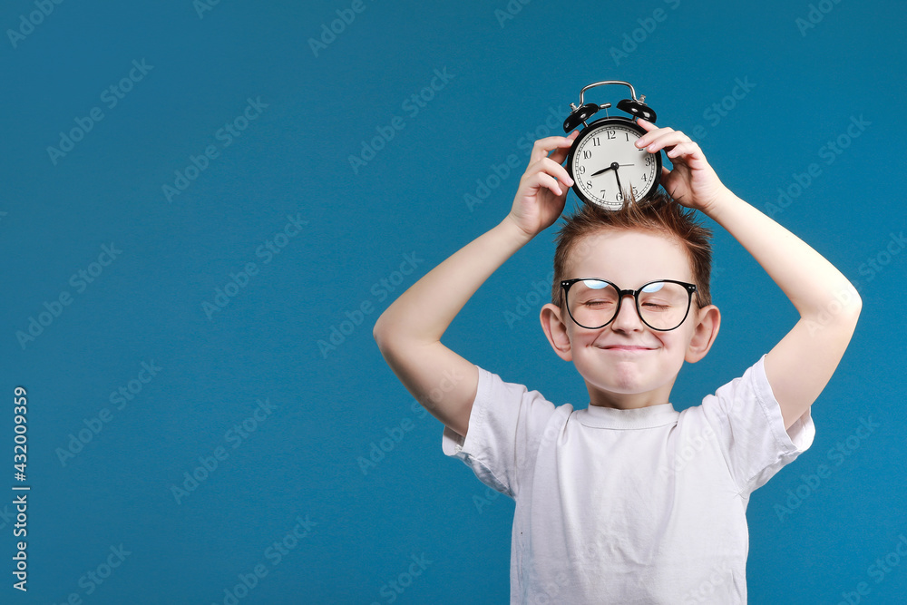Time management. Morning. little boy with alarm clock. Happy childhood ...