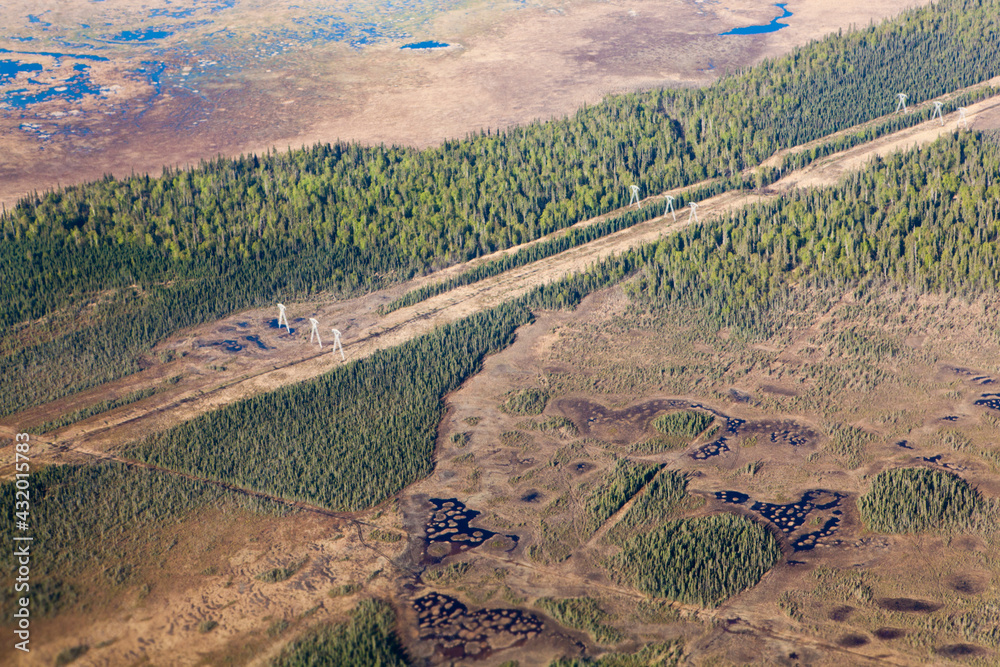 High voltage power lines cut across forest and tundra outside Anchorage ...