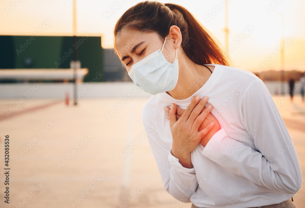 Foto de Portrait of Asian woman having suffering from chest pain or ...