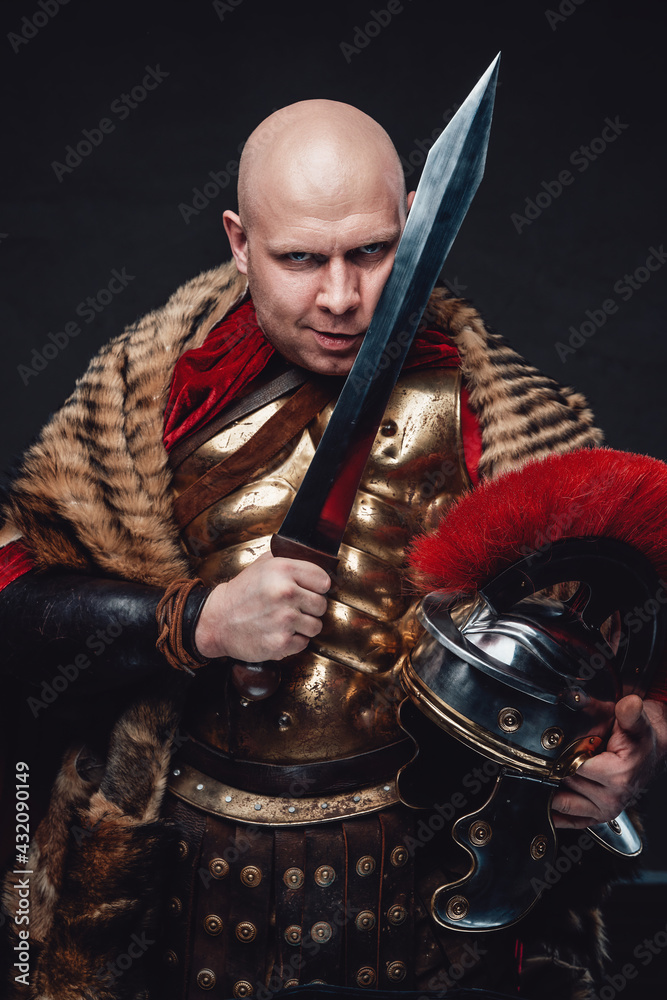 Fearful legionnaire with short sword and helmet Stock Photo | Adobe Stock