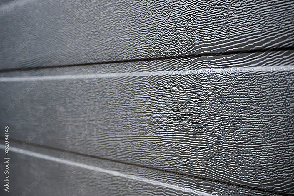 Dark grey siding sliding view side view. Modern material for house ...