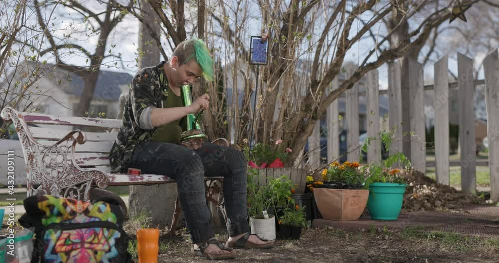 girl taking a bong rip outside in nature vídeo de Stock | Adobe Stock