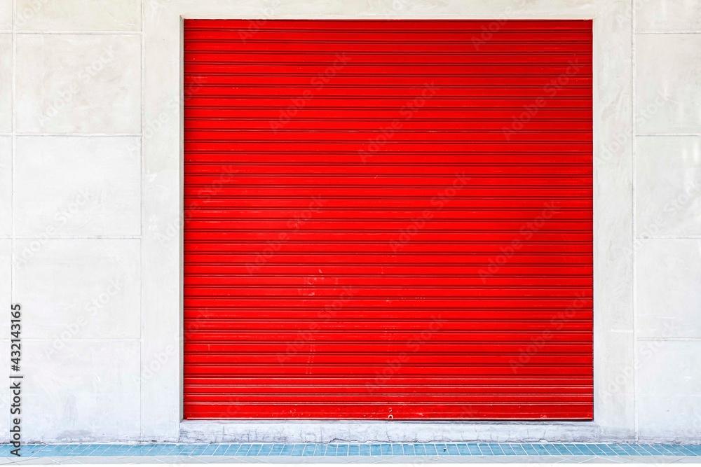 The red roller shutter door of the store is closed Stock Photo | Adobe ...
