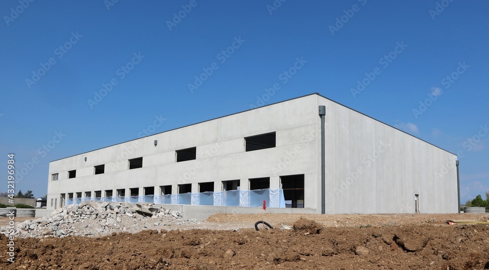 Large industrial warehouse made of prefab concrete blocks, under ...