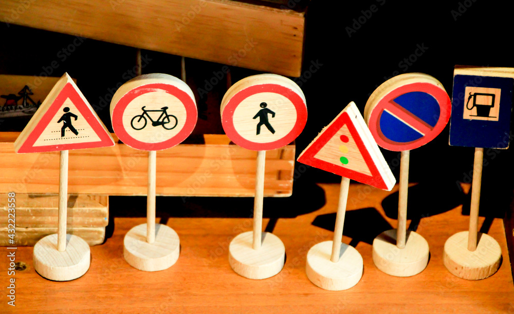 Wooden miniature road signs on a shelf Stock Photo | Adobe Stock