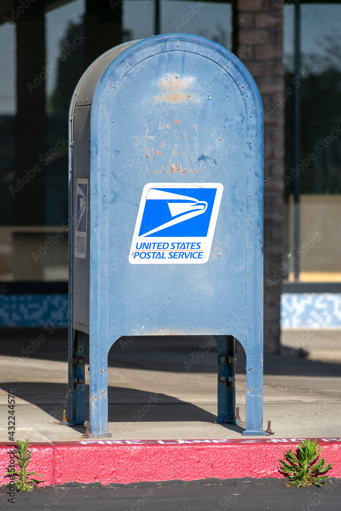 USPS blue outdoor mailbox. Weathered mail collection box of United ...