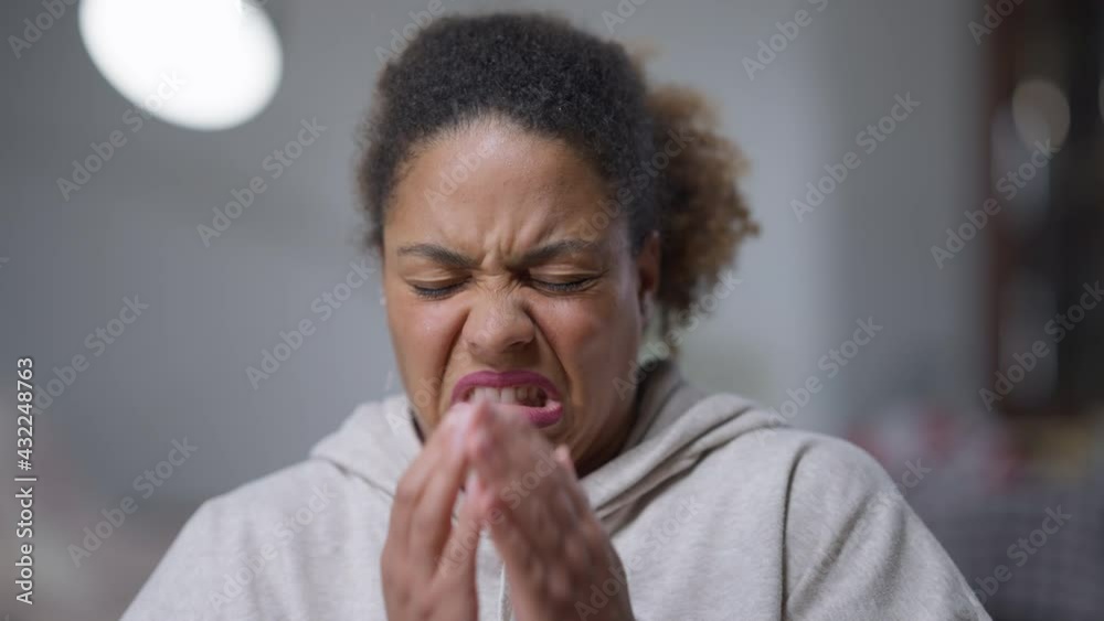 Close-up portrait of African American woman with disgust facial ...