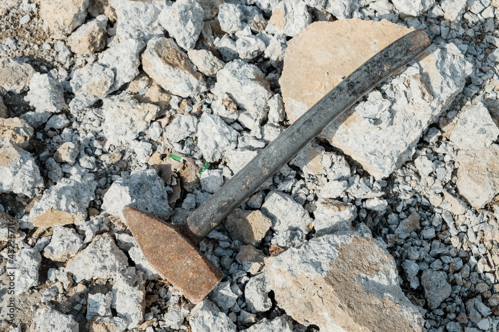 iron hammer breaking stone into pieces. Large sledgehammer for ...