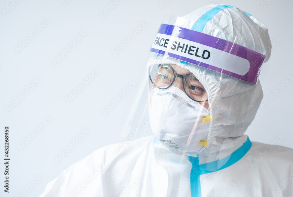 Medical worker wearing PPE suit and others equipment such as mask, face ...