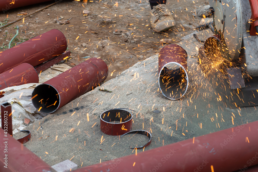 Big steel pipe pipes are being cut from steel cutters by construction ...