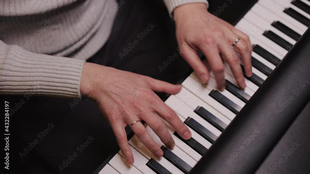 Close-up of pianist's hands professionally play the piano. The pianist ...