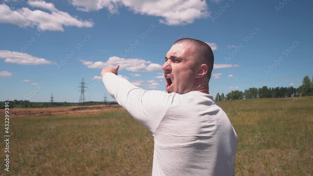 Video Stock Rear View of a Bald Man Who Shouts Forward and Starts ...