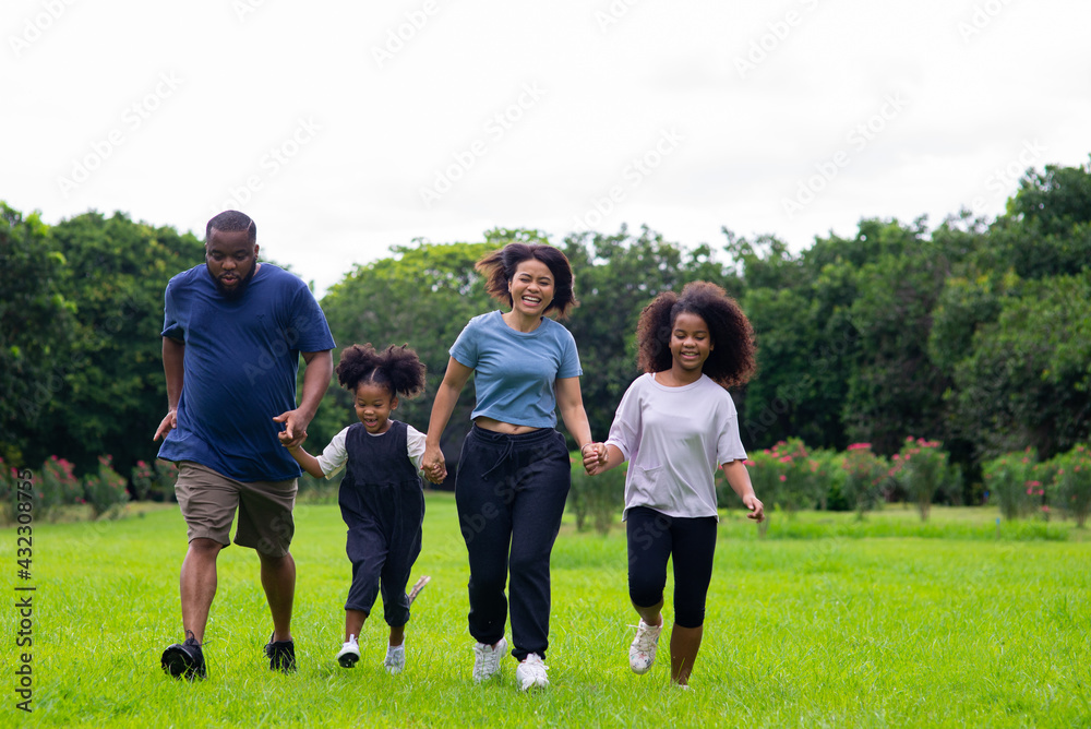 Happy mixed race family African father and Asian mother with two little ...