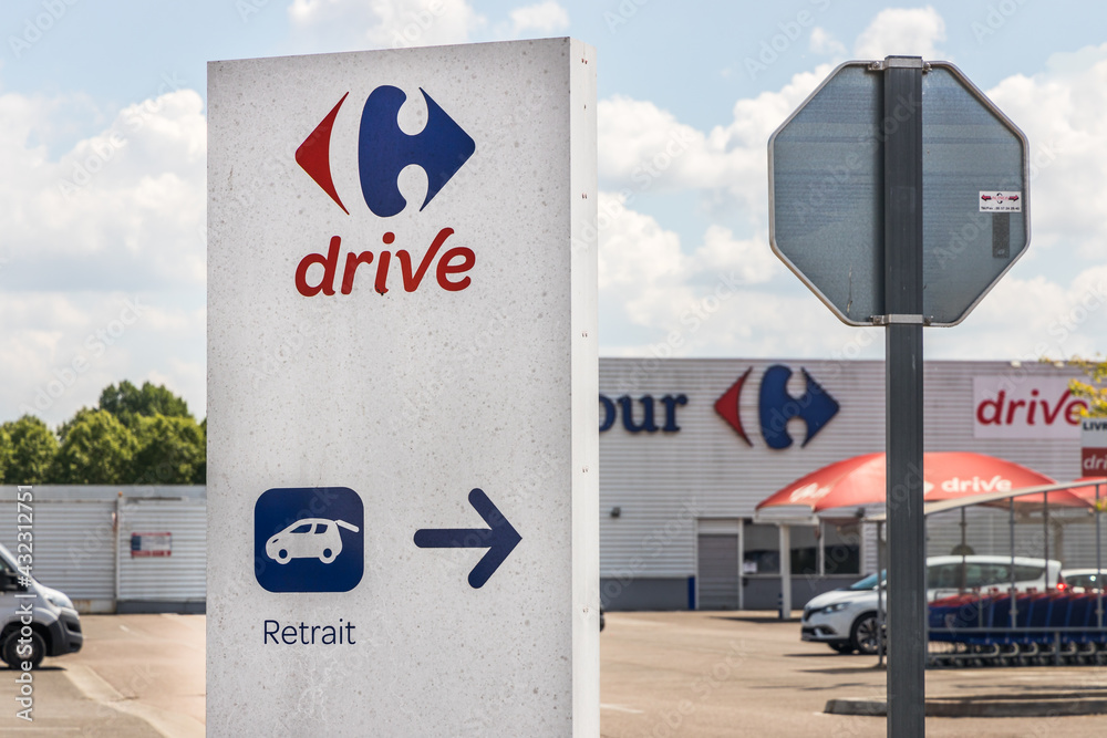Carrefour Drive sign and empty parking lot of the supermarket drive ...
