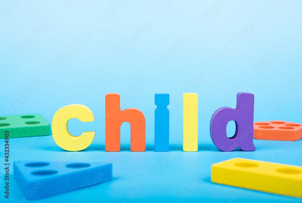 Child word written with wooden alphabets blocks on blue chart kids ...