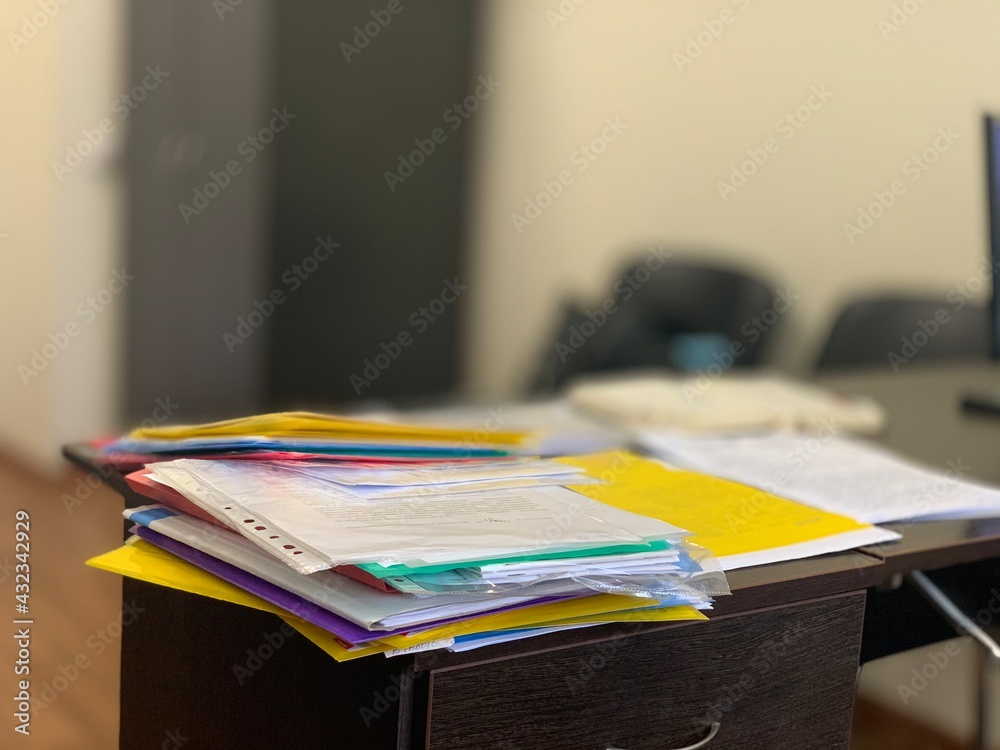 Working mess on the office desk. Workload concept. Work with documents ...