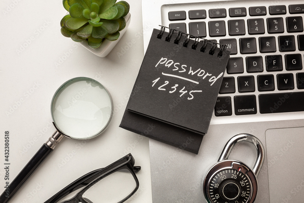 Strong steel coded lock on a laptop keyboard. IT security policies ...