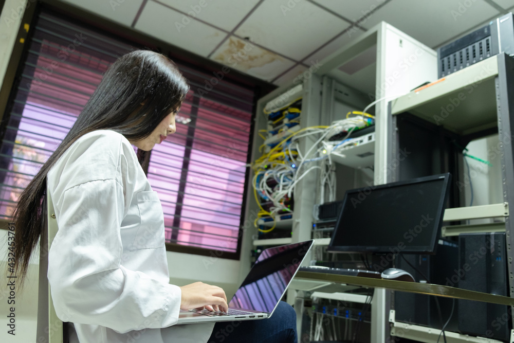 The system administrator works in the server room of the data center ...