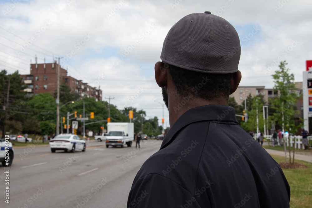 Poster Security guard in uniform patrolling residential area – Wall Art ...