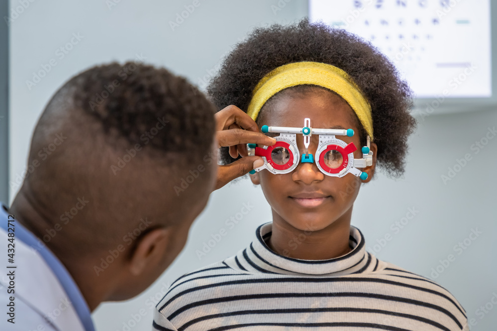 African young woman girl doing eye test checking examination with male ...