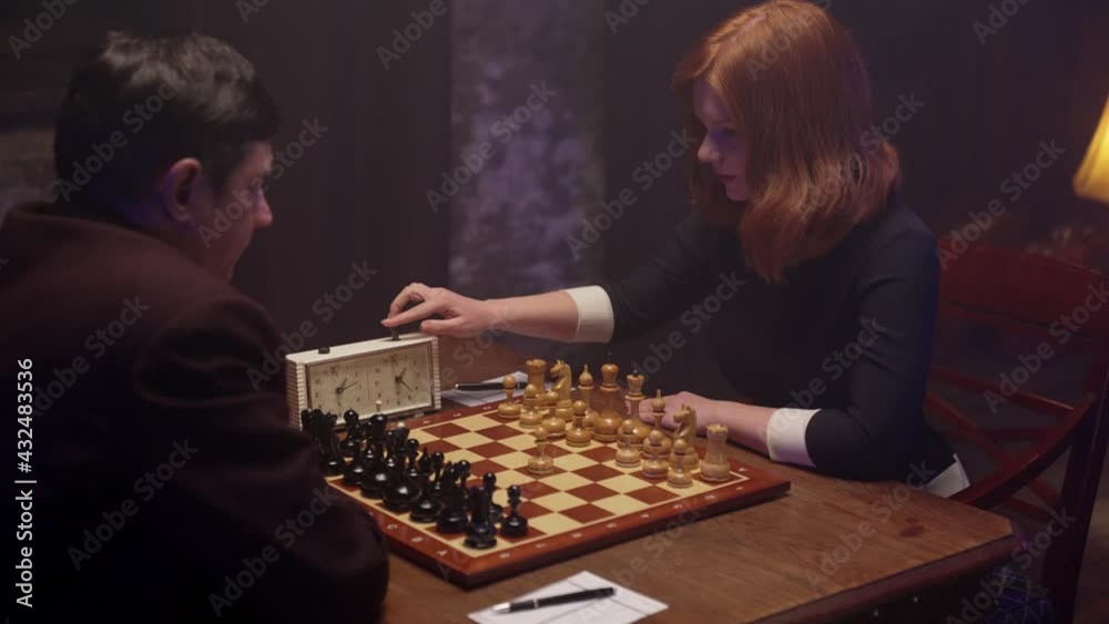 Two chess players man and woman play chess. Debut Accepted Queen's ...