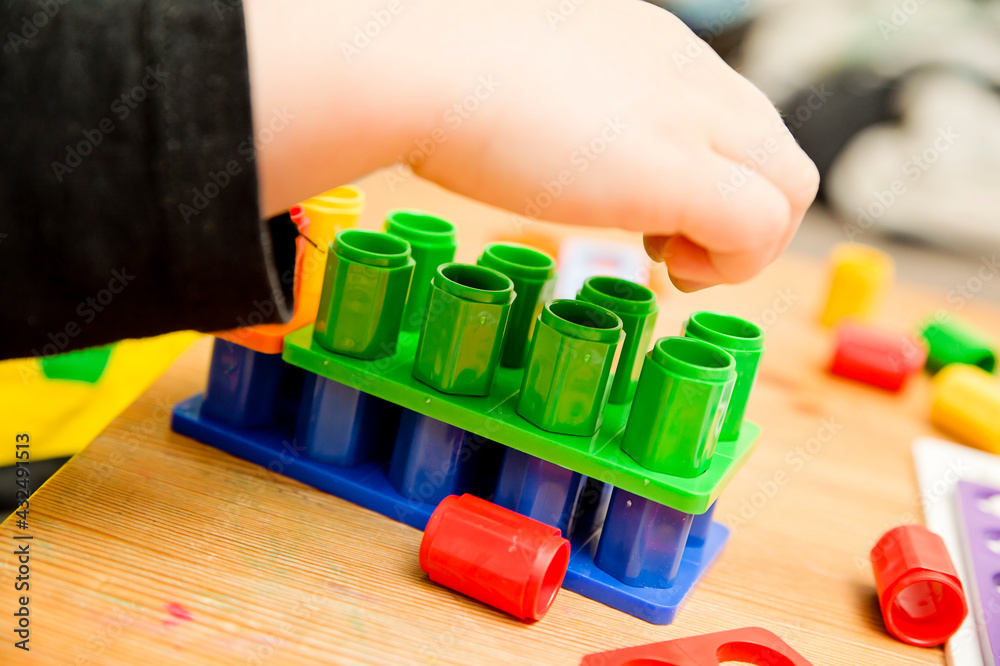 Kids hand on figures. Learning to count through the game. Tool to easy ...