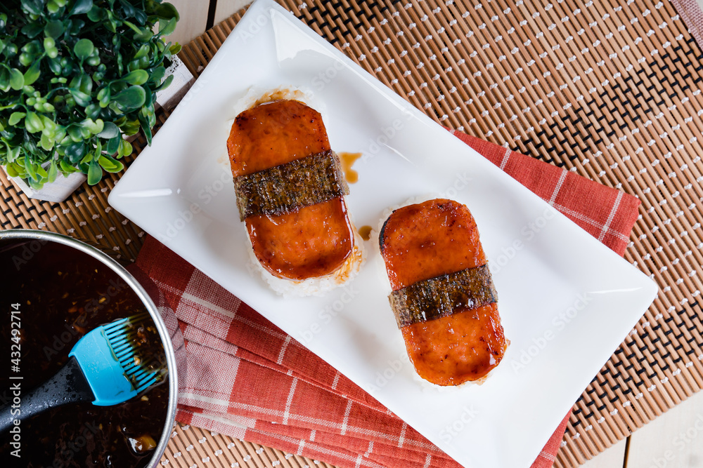 Spam musubi is a popular snack and lunch food in Japan that composed of ...