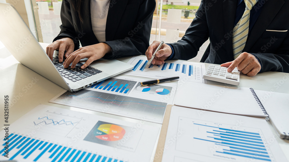 Businessman, accounting, calculating, analyzing, charting and graphing ...