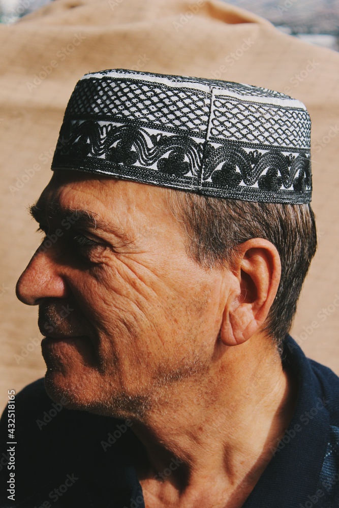Left side closeup portrait of smiling Turkish Muslim man with Taqiyah ...