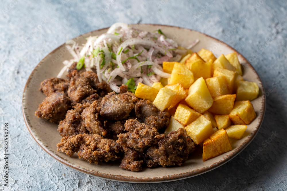 Liver pan (Albanian liver) Turkish traditional food. Liver over rice ...