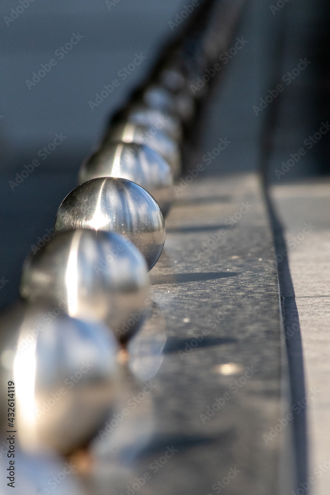 Matt steel balls in a row as decorative and ornamental balustrade and ...