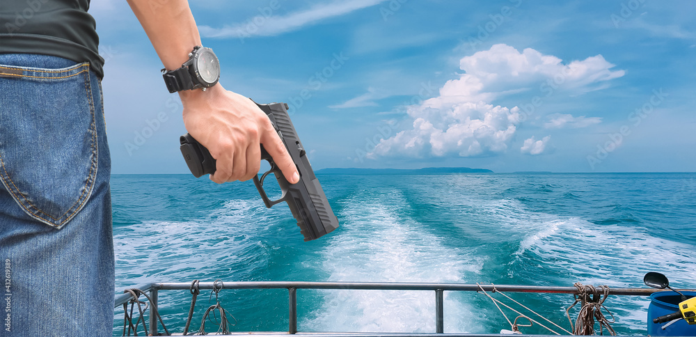 Automatic black 9mm pistol holding in hand, concept for security ...