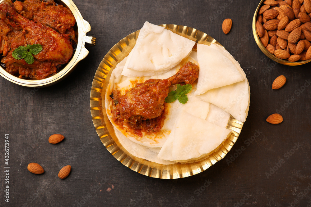 Rice pathiri flat bread with spicy chicken leg curry golden plate ...