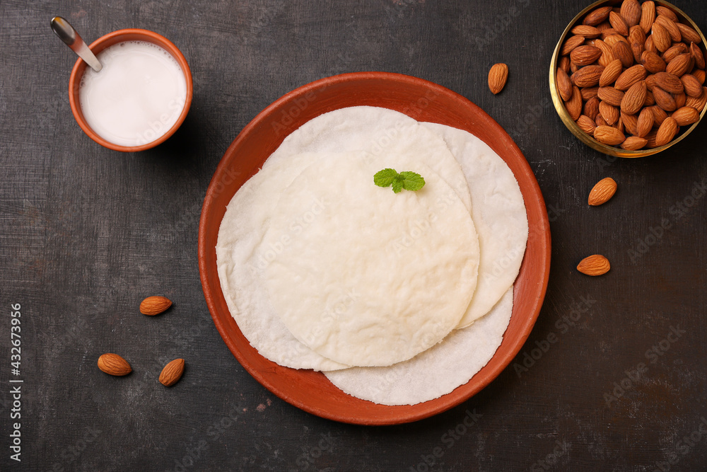 Rice Pathiri pathir flat bread with spicy chicken curry, coconut milk ...