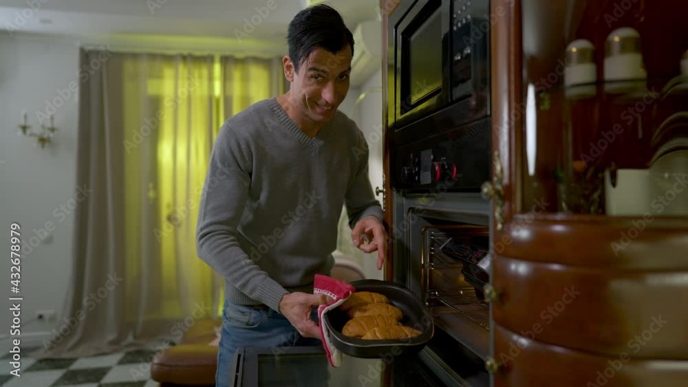 Portrait of proud Middle Eastern chef boasting tasty fresh baked ...