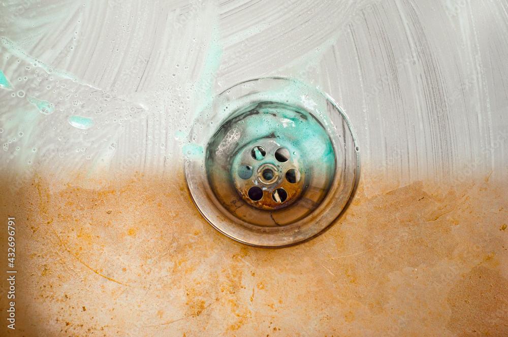 Drain hole of the kitchen sink before and after applying special ...