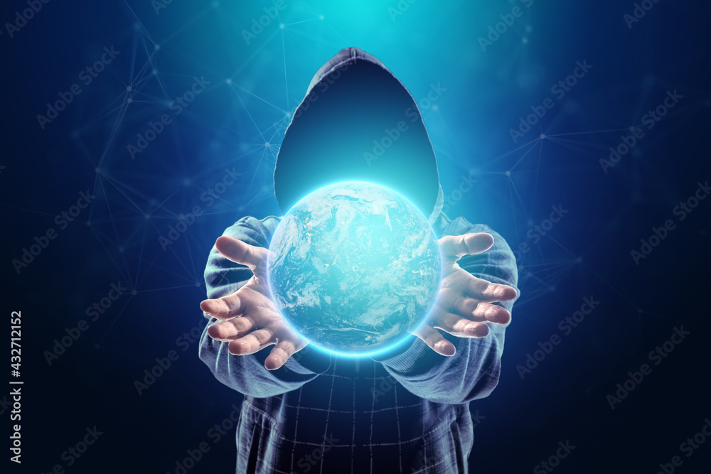 The planet earth is in the hands of a hacker, a man in a hood holds the ...