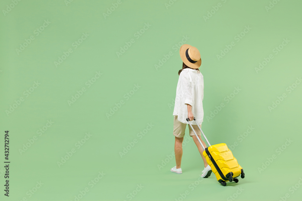 Full length rear back view traveler tourist woman in casual clothes hat ...