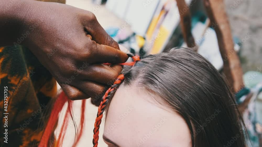Black African woman weaving African-American small braids to beautiful ...