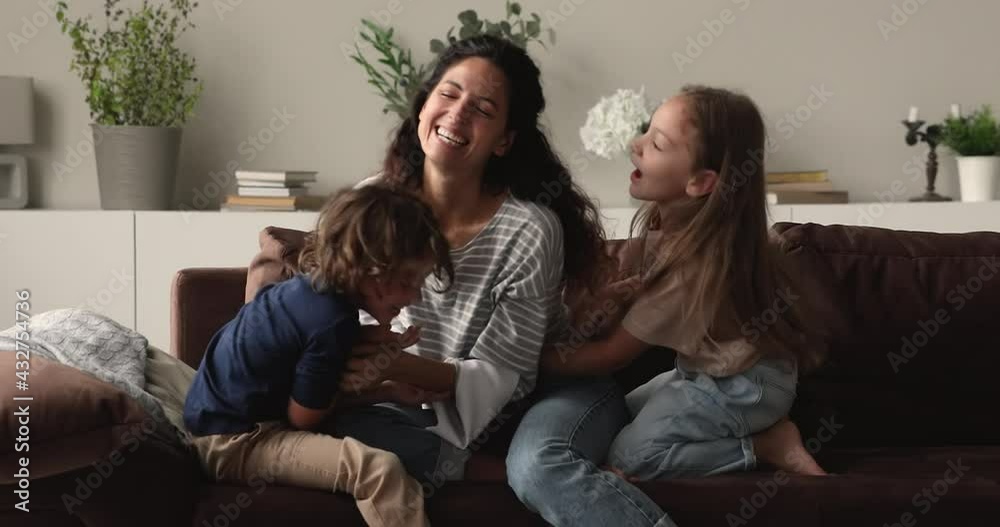 Loving millennial hispanic nanny babysitter having fun with sincere ...