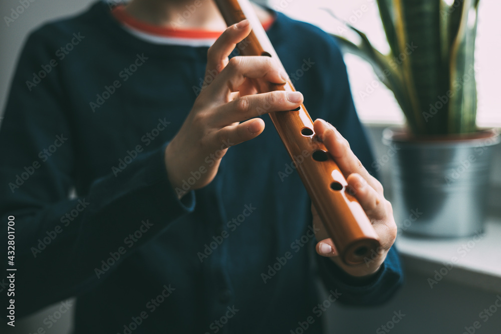 Girl with Peruvian origins performs with a Quena, a traditional wind ...