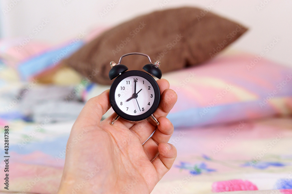 alarm clock in hand. Morning of a new day, alarm clock wake up. Health ...