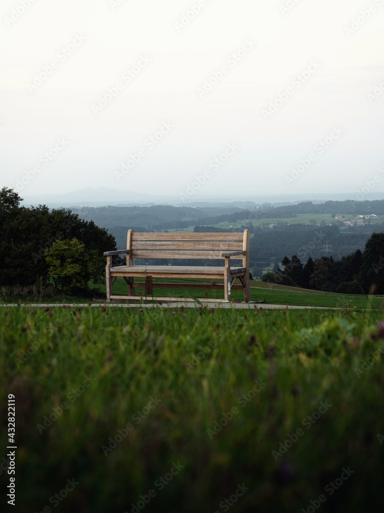 Panorama view of oversized wooden bench seat Wanderbank Allgau in Oy ...