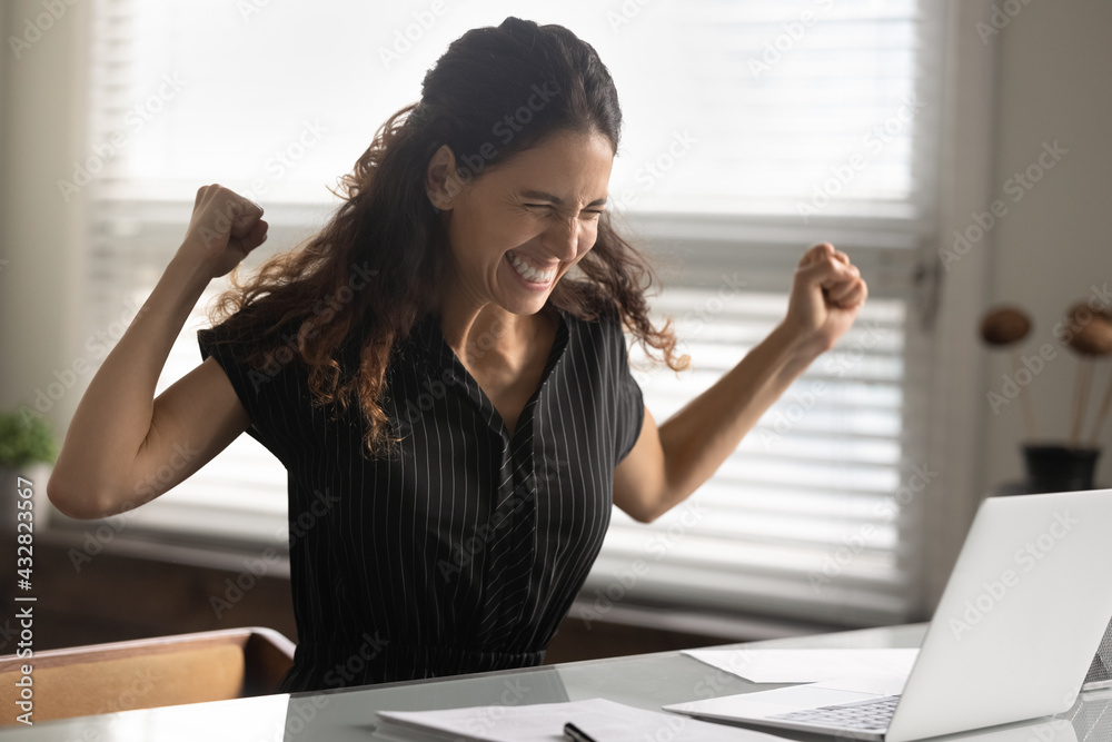 Getting promotion. Joyful young latin woman office worker yell look on ...