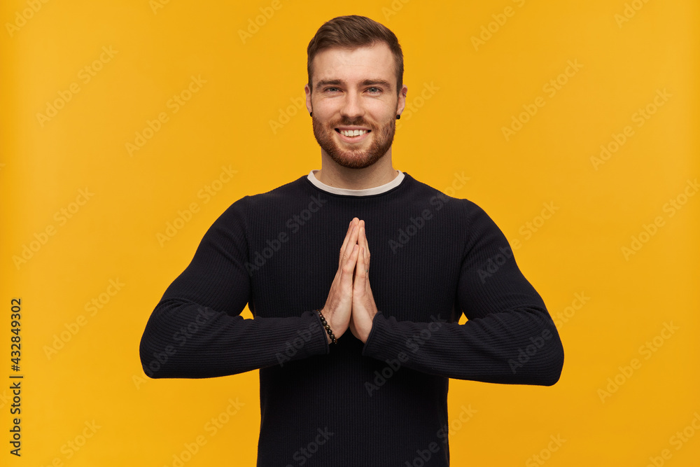 Portrait of handsome, positive male with brunette hair and beard. Has ...