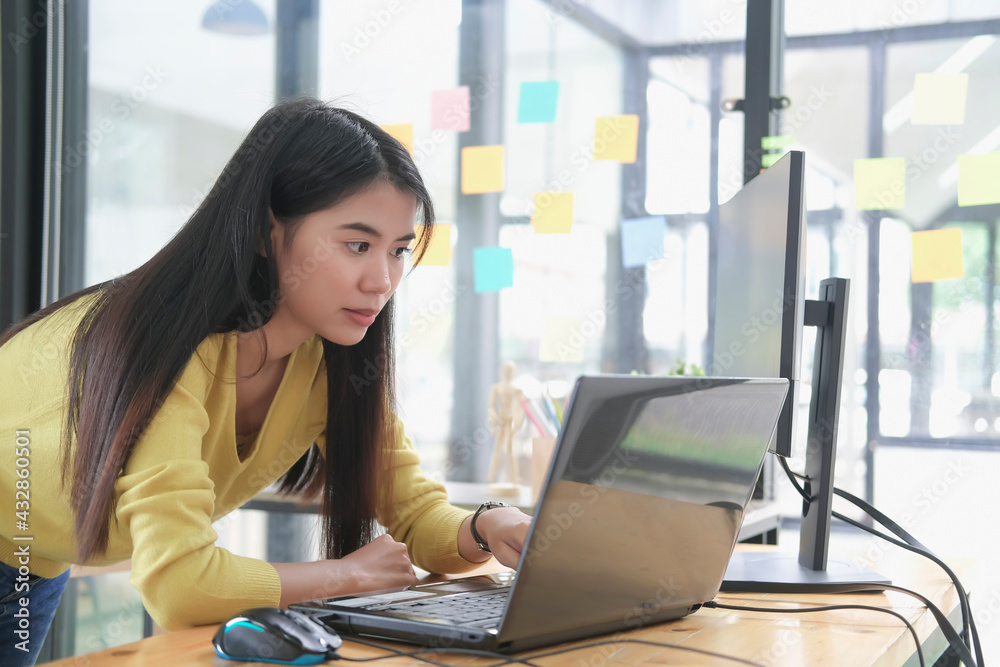 Developing programmer team typing source codes and Website design in ...