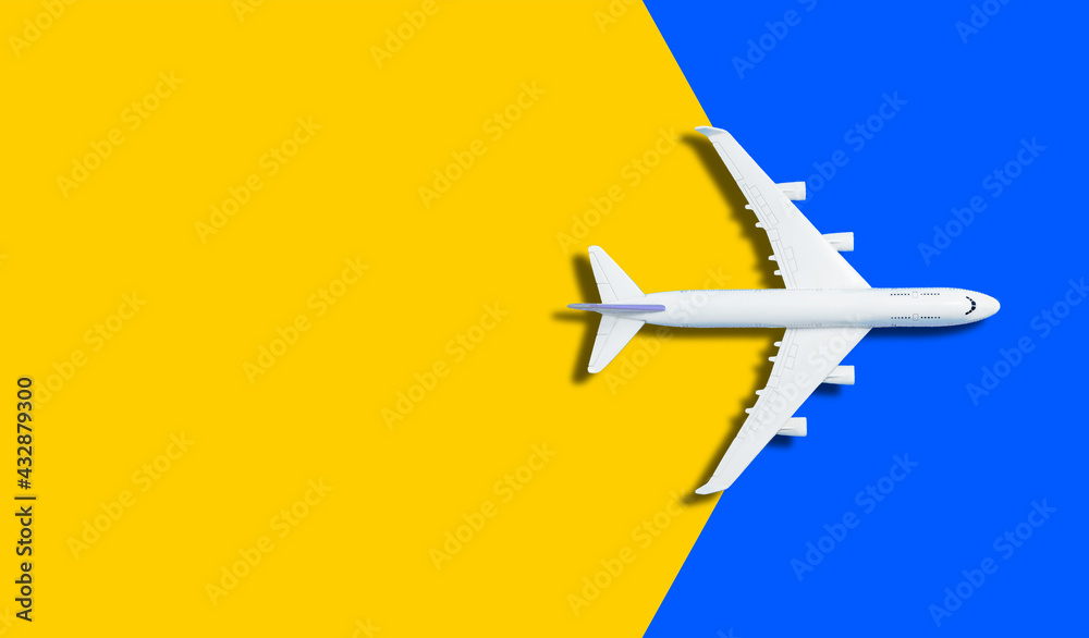 Flat lay design of travel concept with plane on blue and yellow ...