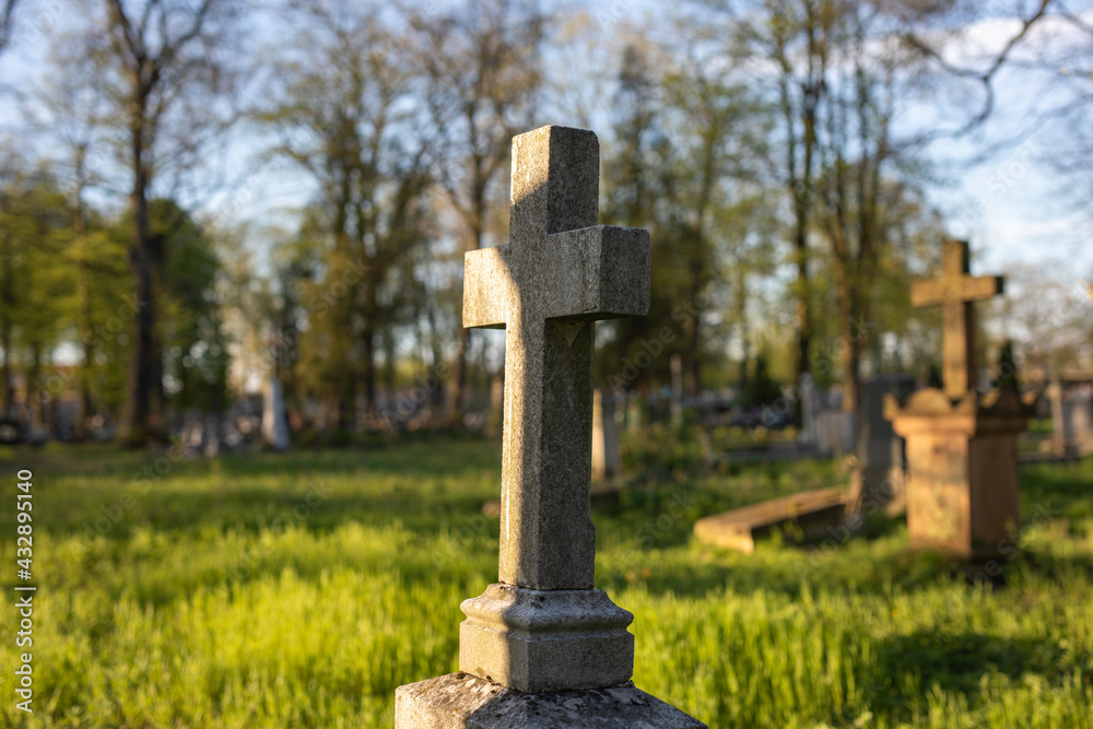 Foto de beautiful christian stone cross in an old forgotten cemetery ...