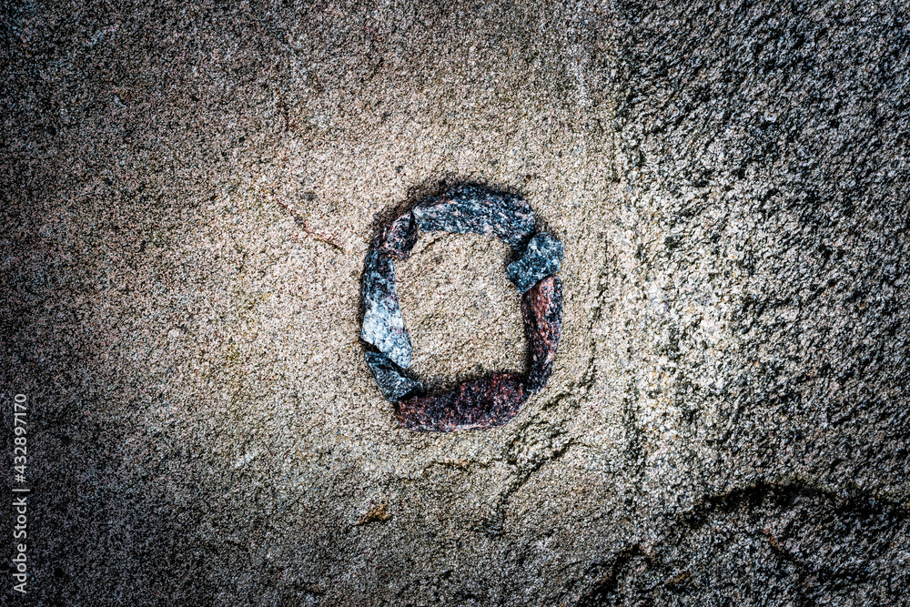 Latin letter "O" paved stones on the rock. View from above, image ...