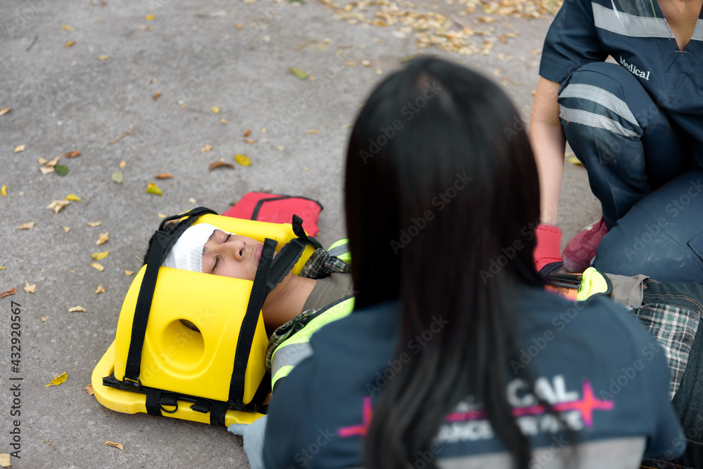 Emergency Medical First aid for head injuries of worker accident in ...